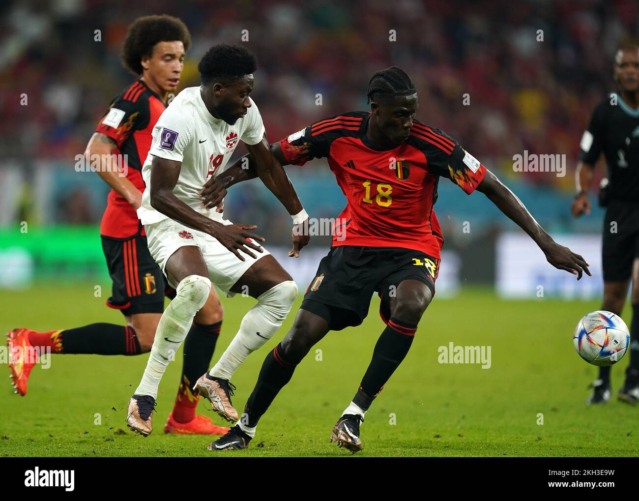Canada's Alphonso Davies and Belgium's Amadou Onana battle for the ball ...