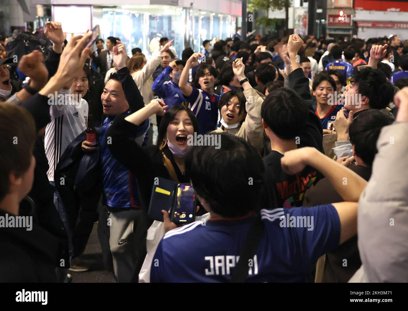Tokyo, Japan. 24th Nov, 2022. Japanese football fans celebrate Japan's ...
