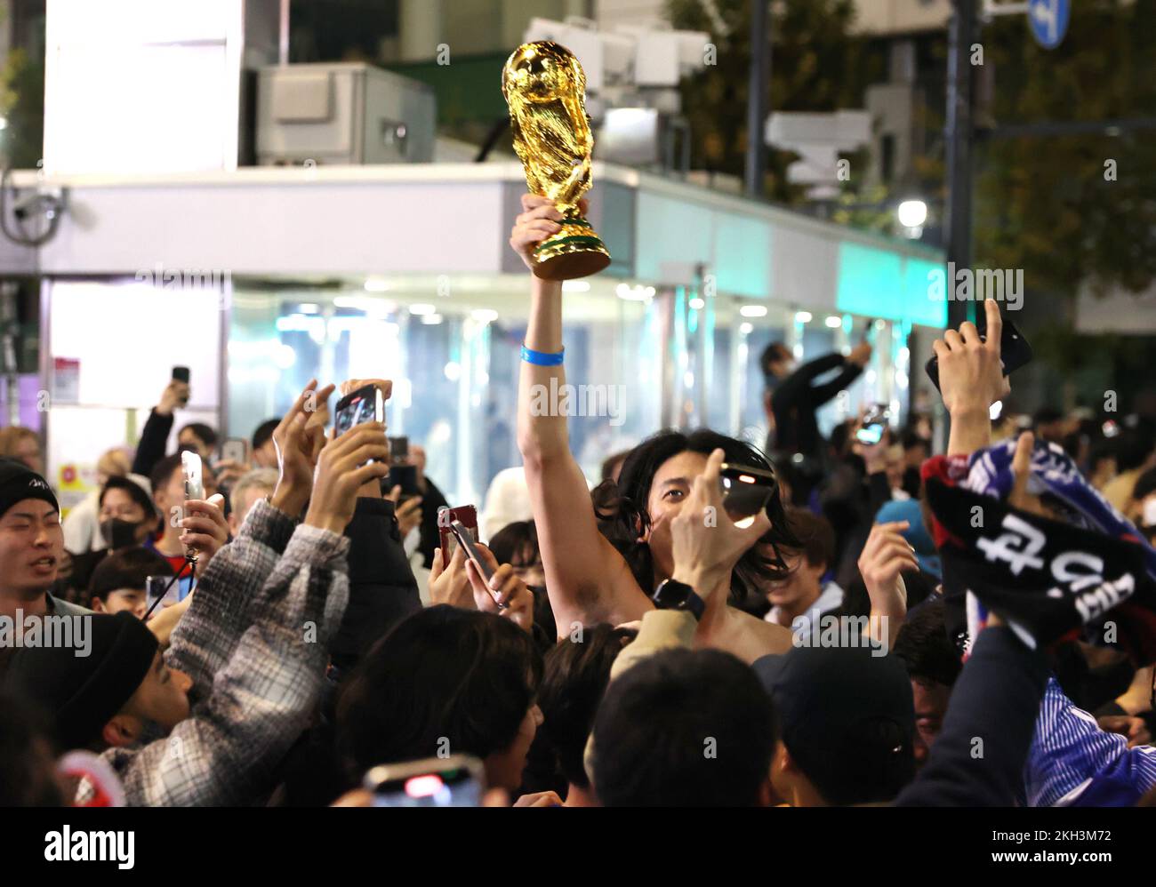 Tokyo, Japan. 24th Nov, 2022. Japanese football fans celebrate Japan's ...