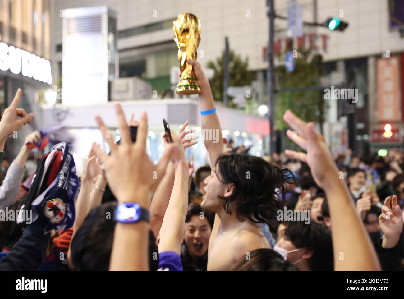 Tokyo, Japan. 24th Nov, 2022. Japanese football fans celebrate Japan's ...