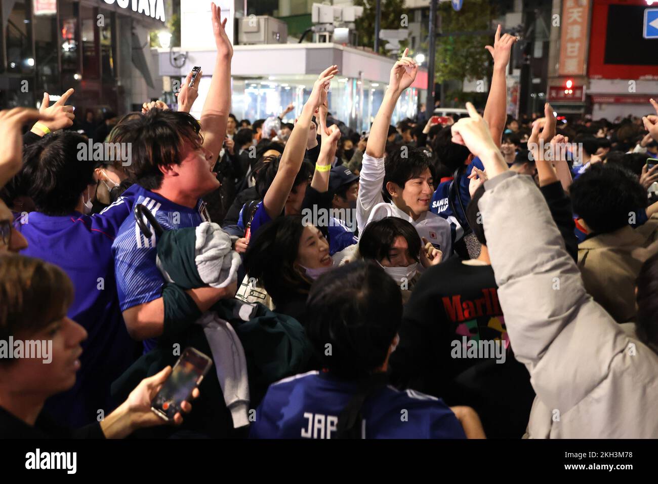 Tokyo, Japan. 24th Nov, 2022. Japanese football fans celebrate Japan's ...