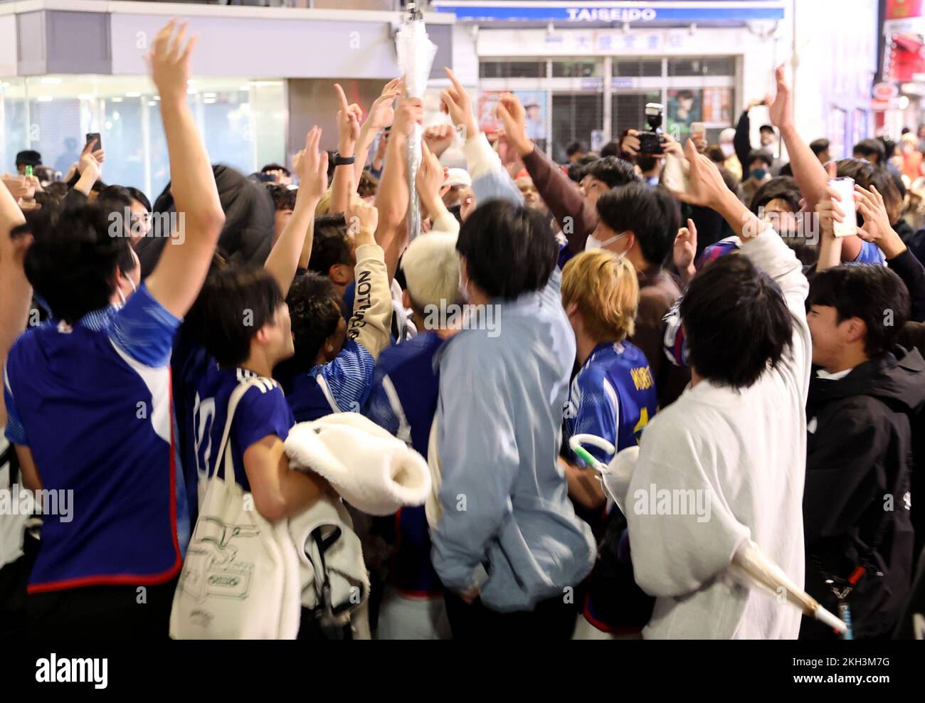 Tokyo, Japan. 24th Nov, 2022. Japanese football fans celebrate Japan's ...