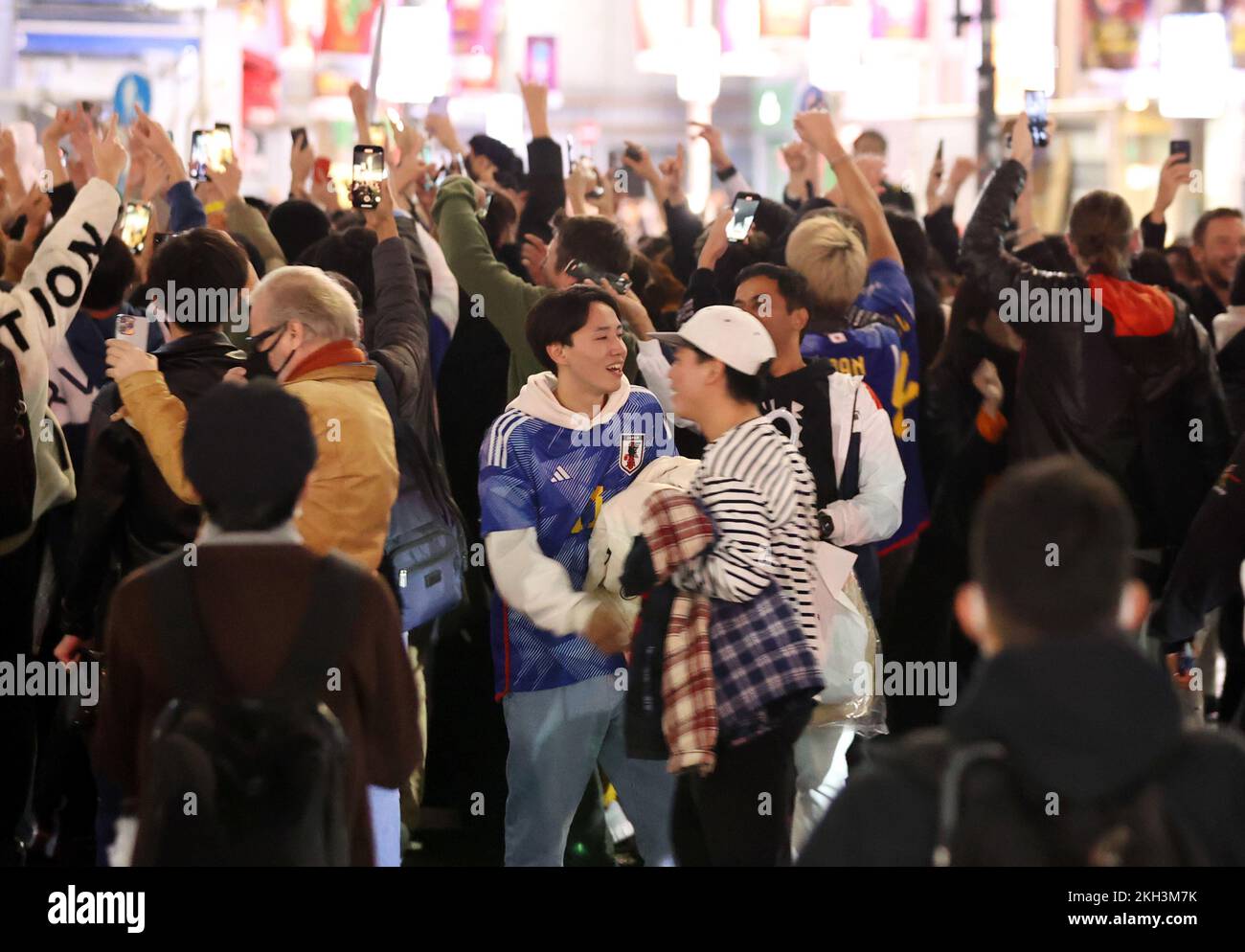 Tokyo, Japan. 24th Nov, 2022. Japanese football fans celebrate Japan's ...
