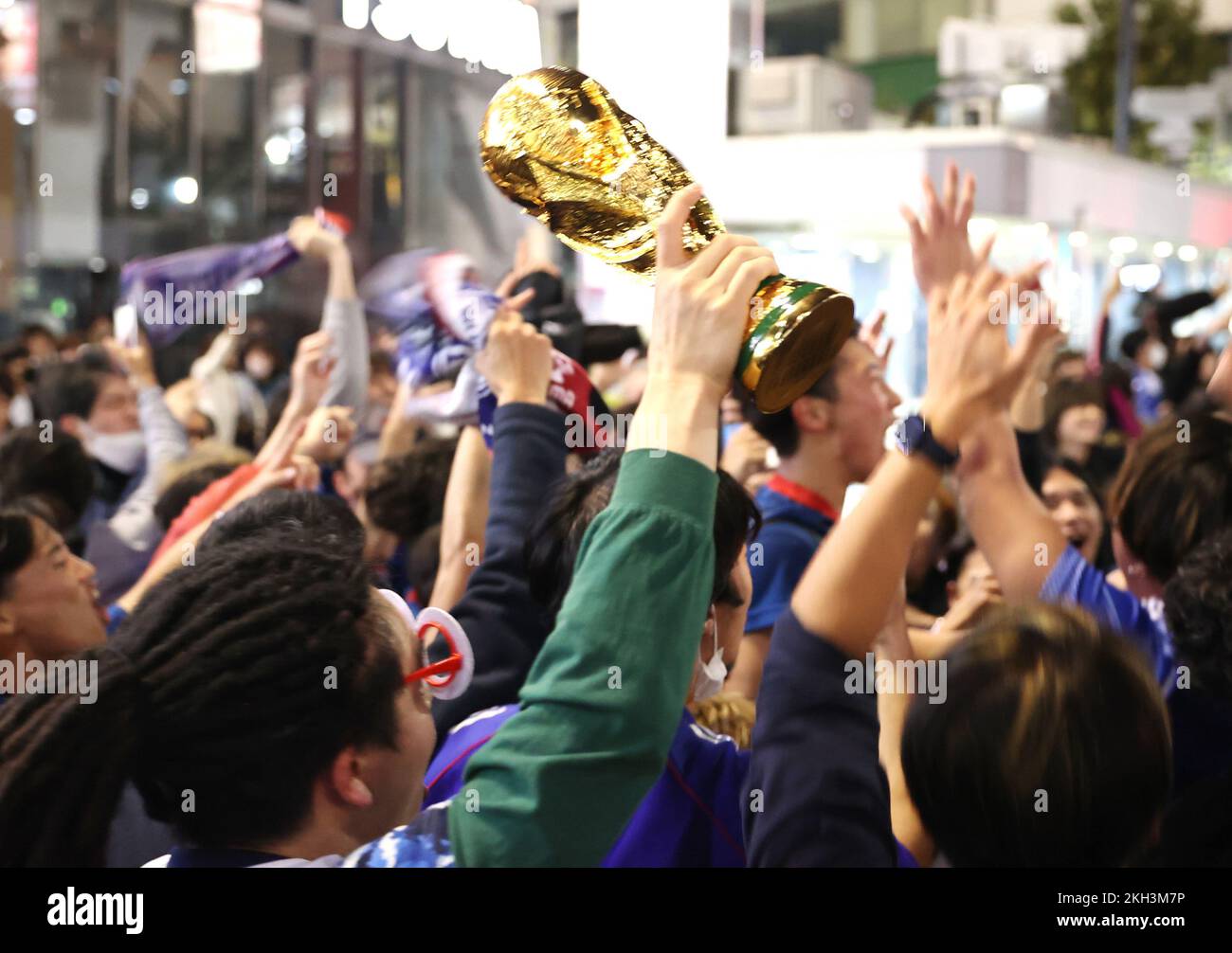 Tokyo, Japan. 24th Nov, 2022. Japanese football fans celebrate Japan's ...
