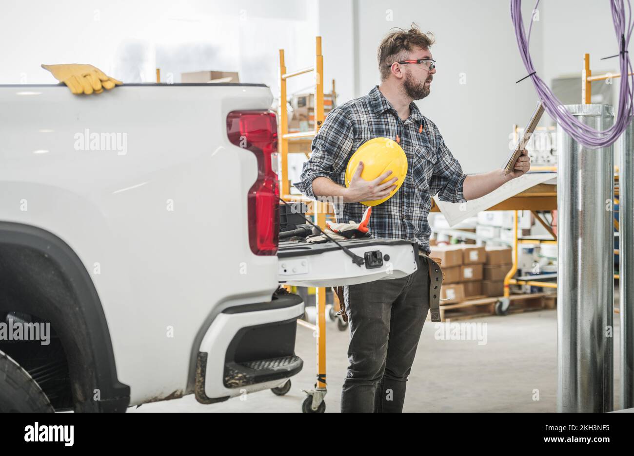 Professional Construction Supervisor Checking the Punch List to Monitor ...