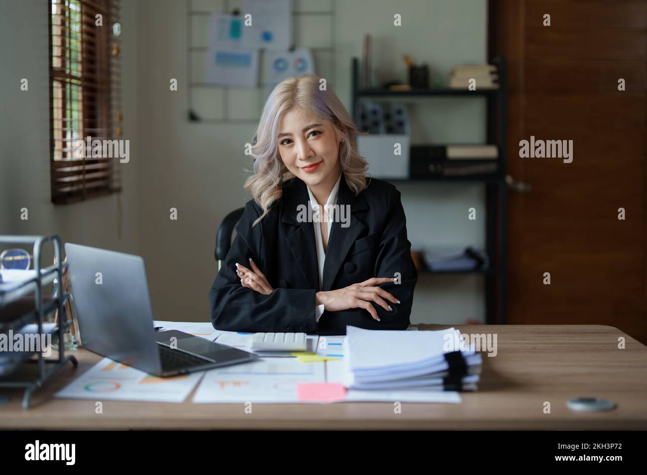 Portrait of a woman business owner showing a happy smiling face as he ...