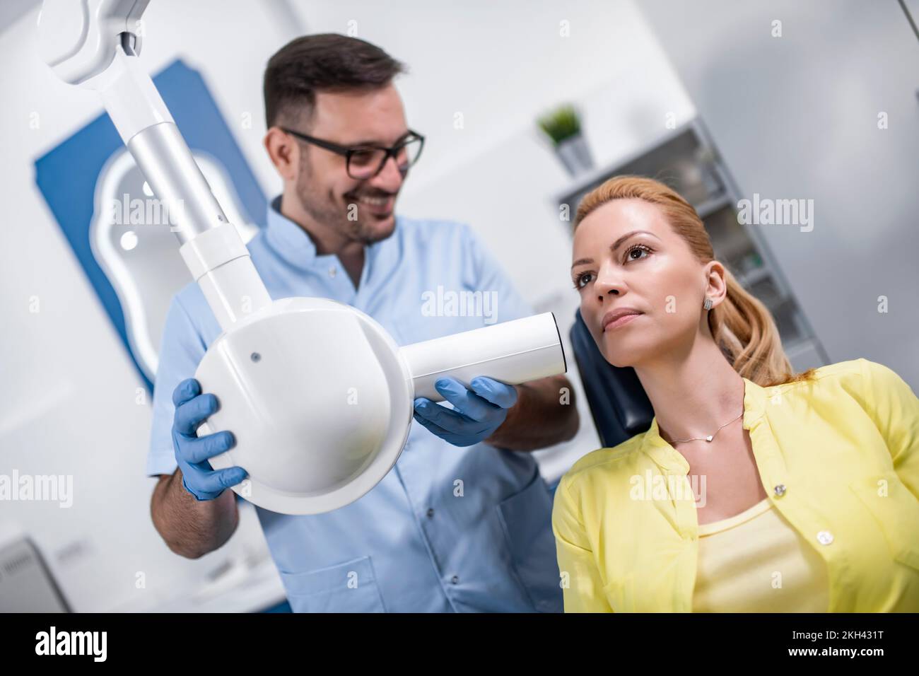 Dentist prepare to make tooth x-ray image for patient in dental clinic ...