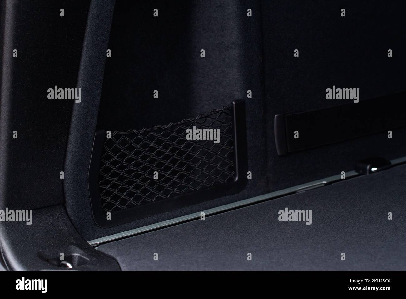 The luggage net inside modern car trunk Stock Photo - Alamy