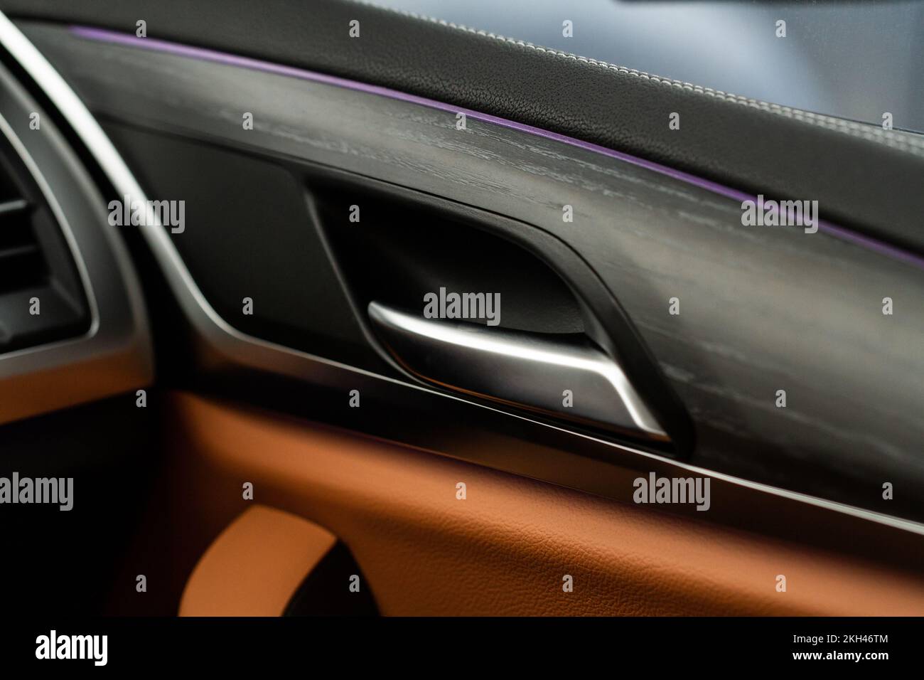 Modern car interior door handle close up. Metallic Car door opener ...