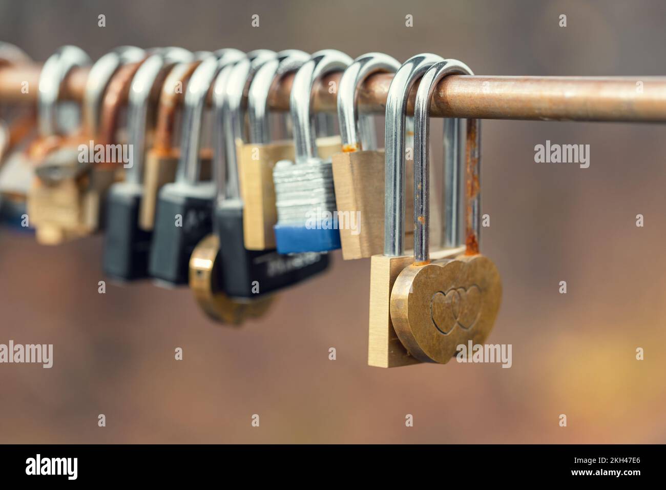Heart shape love locks hanging on bridge in autumn. Concept of love ...