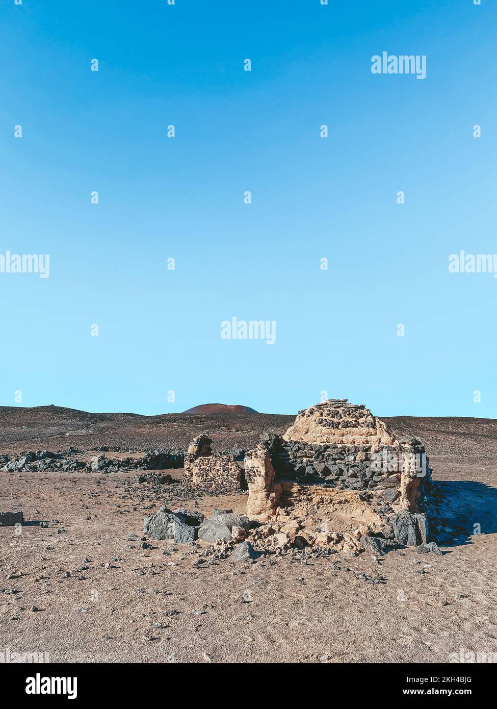 A vertical shot of the old construction made with volcanic stones at ...
