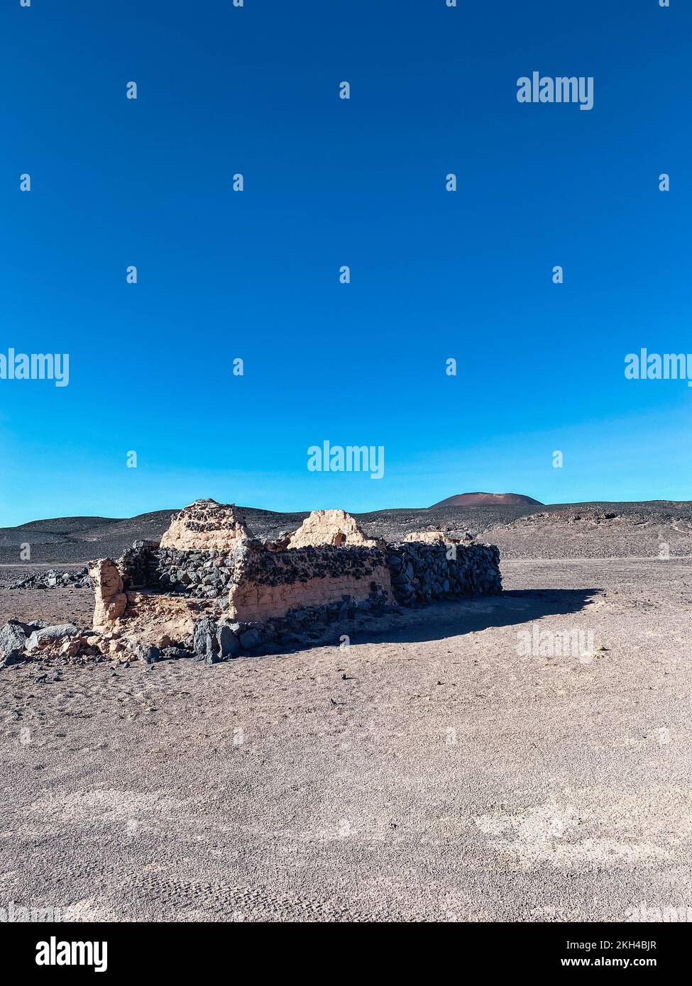 A vertical shot of the old construction made with volcanic stones at ...