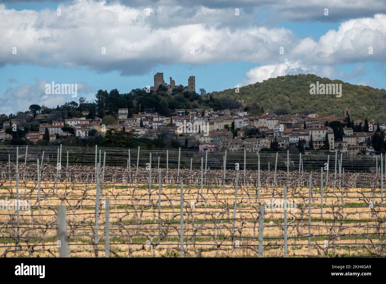 Grimaud a medieval village at the top of a hill from Massif des Maures ...