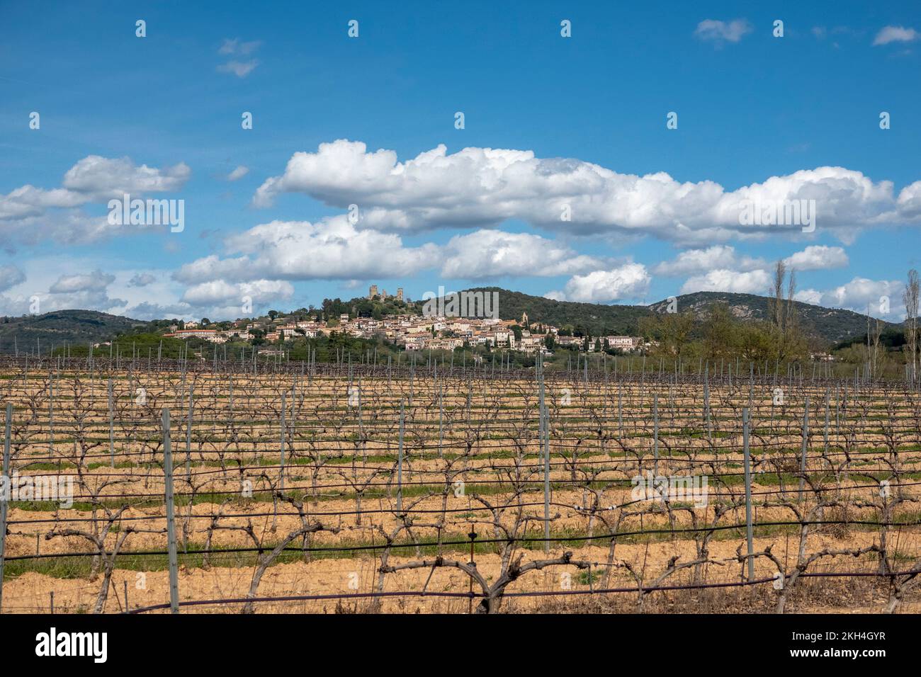 Grimaud a medieval village at the top of a hill from Massif des Maures ...