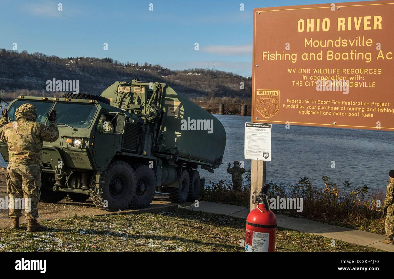 Soldiers for the 459th Engineer Company unload an Improved Ribbon ...