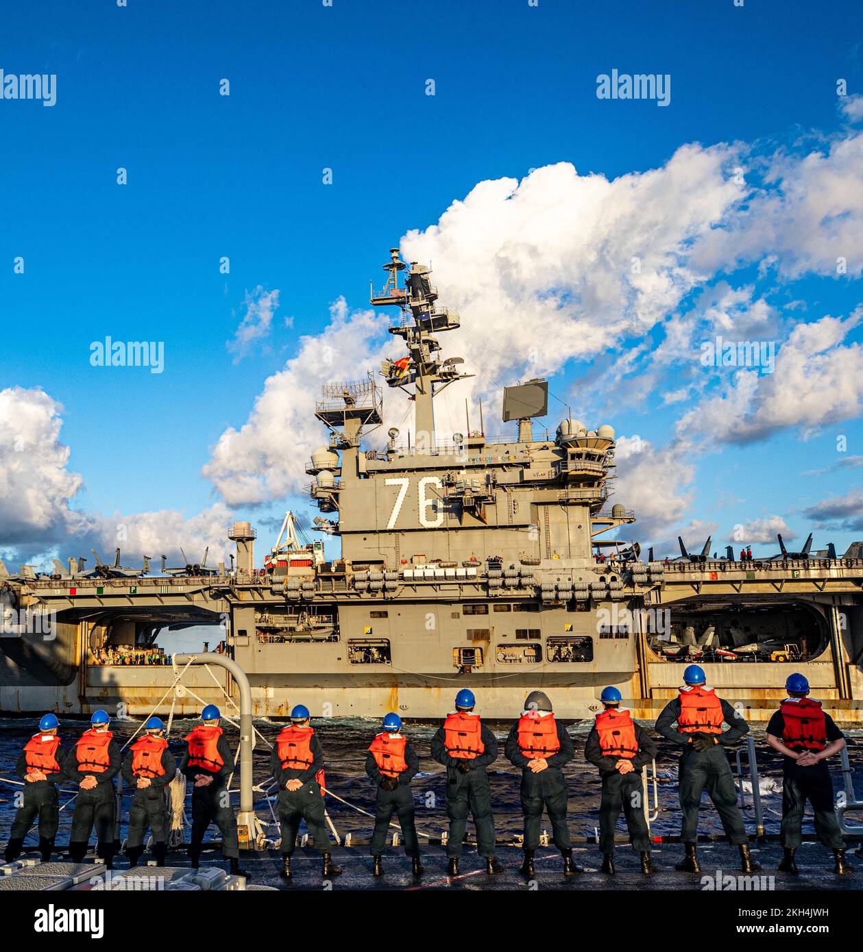 PHILIPPINE SEA (Nov. 22, 2022) Sailors stand at parade rest aboard ...