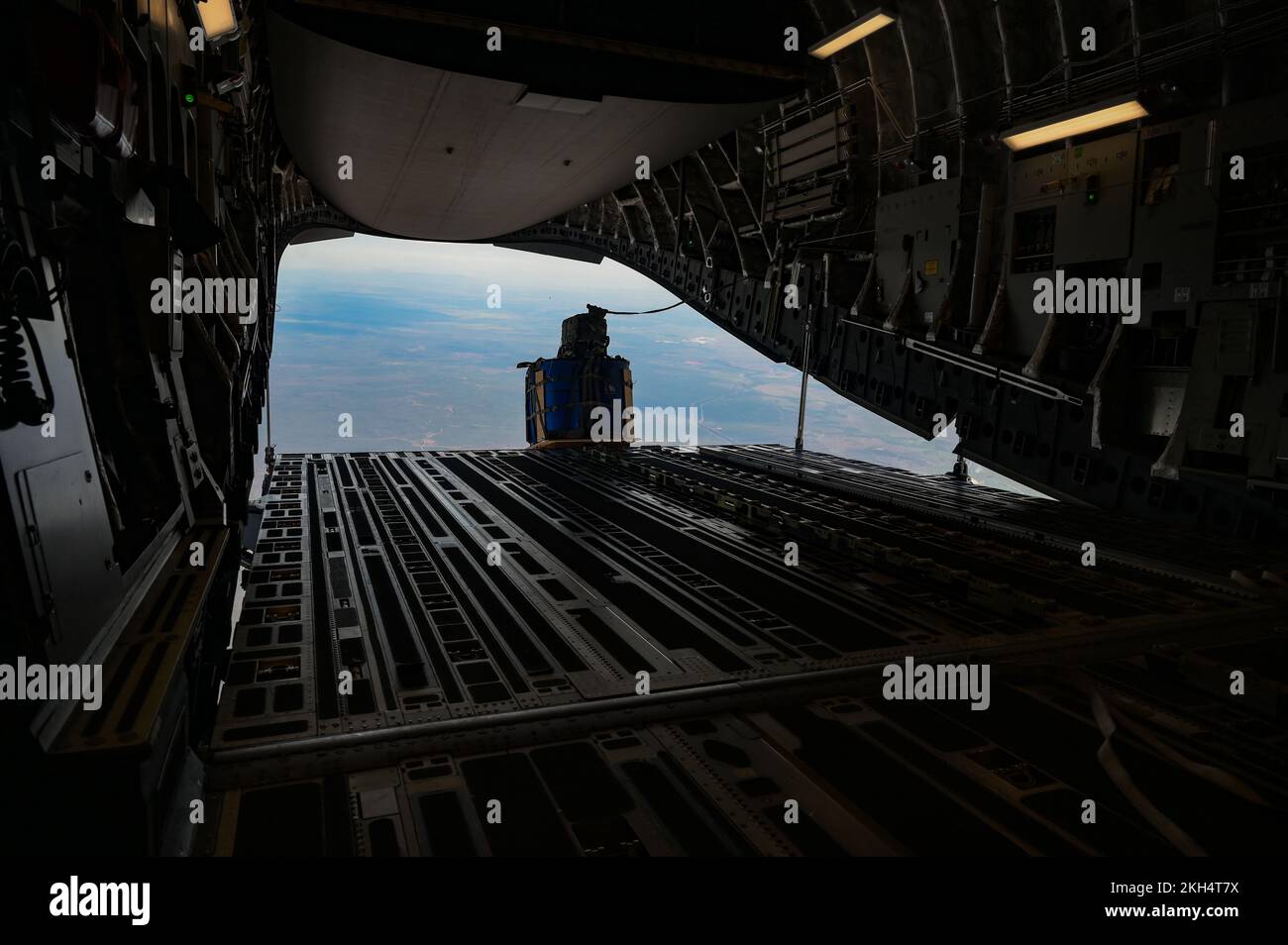 A joint precision airdrop system bundle is deployed from a U.S. Air ...