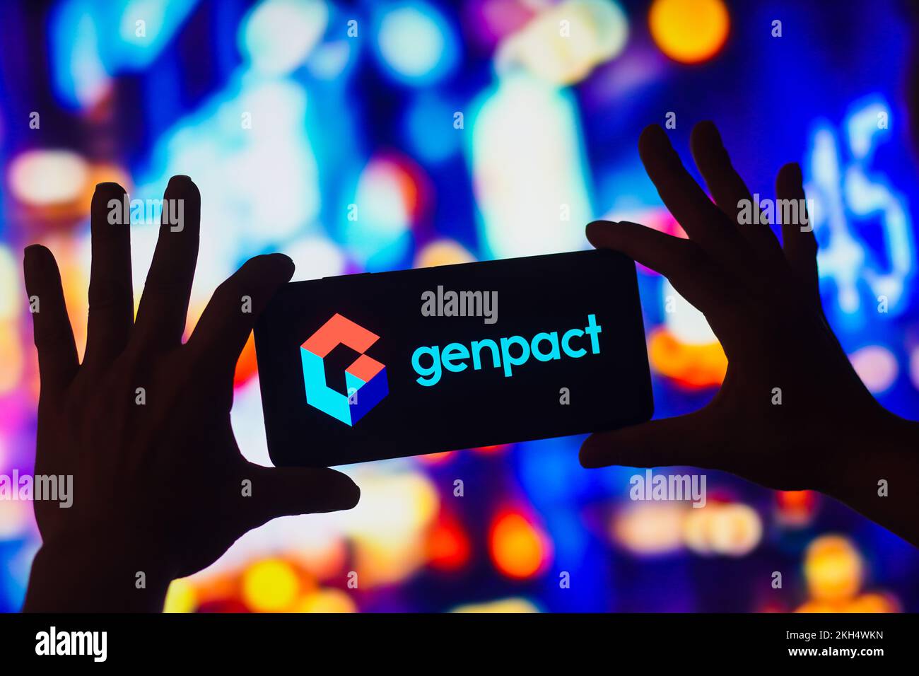 In this photo illustration, the Genpact logo is displayed on a ...