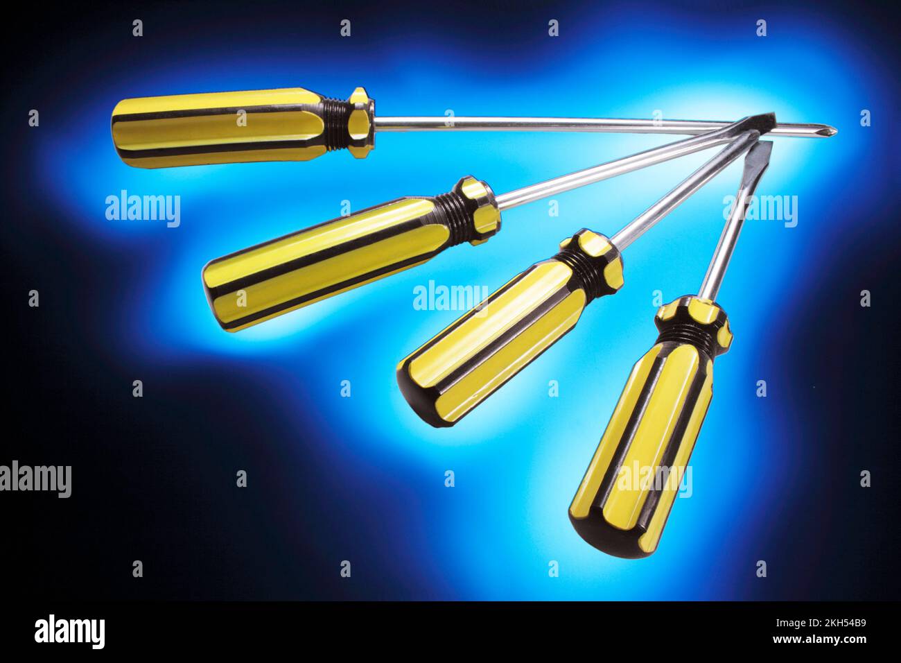 Screw Drivers on Blue Background Stock Photo - Alamy