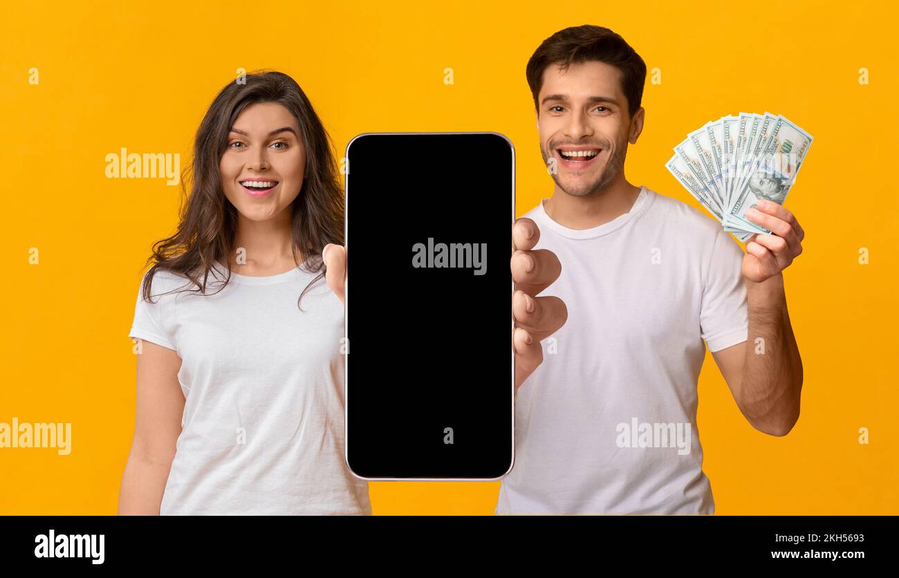 Happy beautiful young couple enjoying prize, gambling online, mockup ...