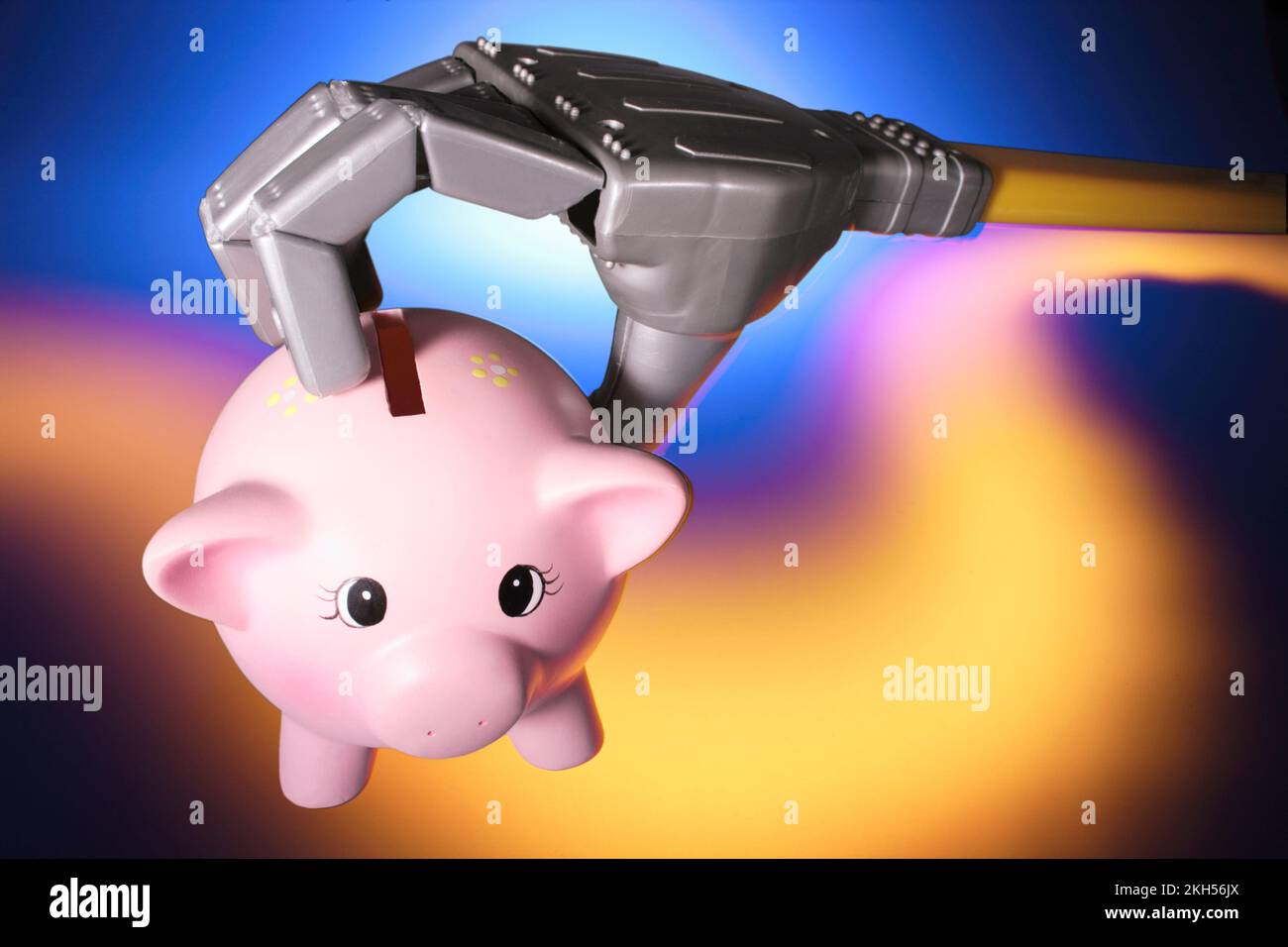Robotic Hand with Piggy Bank Stock Photo - Alamy