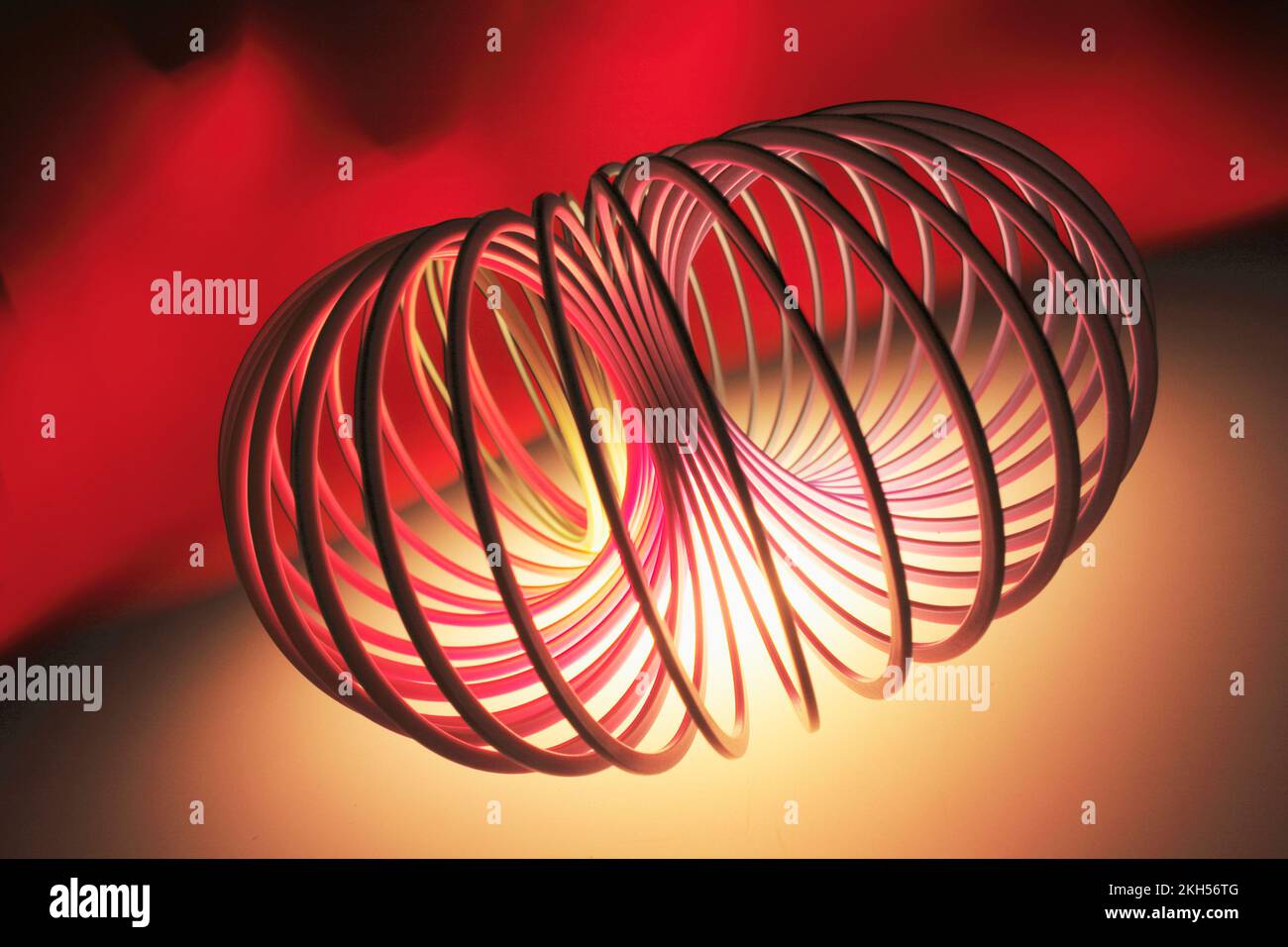 Spring Spiral Toy on Warm Background Stock Photo - Alamy