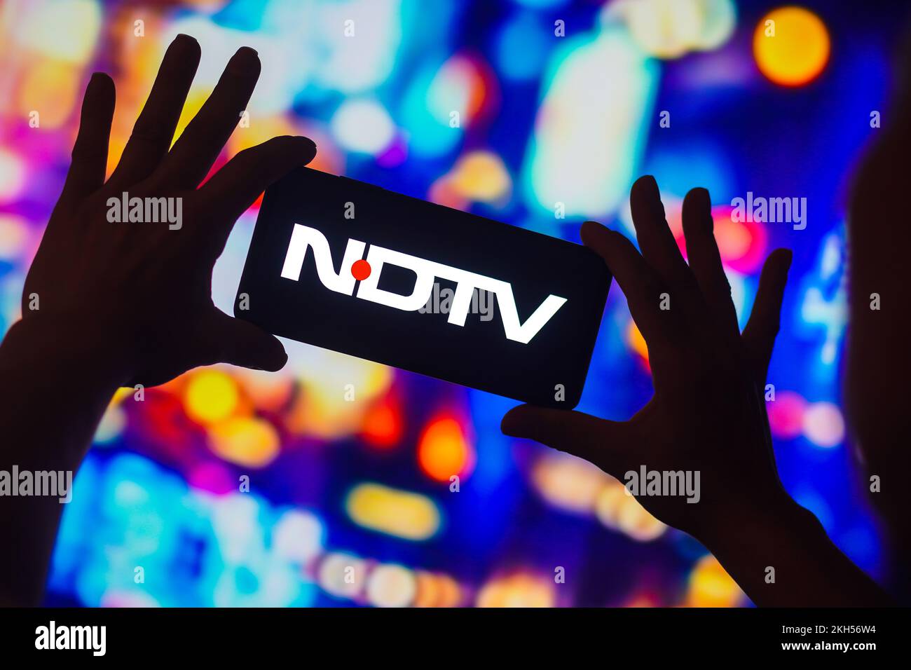 In this photo illustration, the New Delhi Television (NDTV) logo is ...