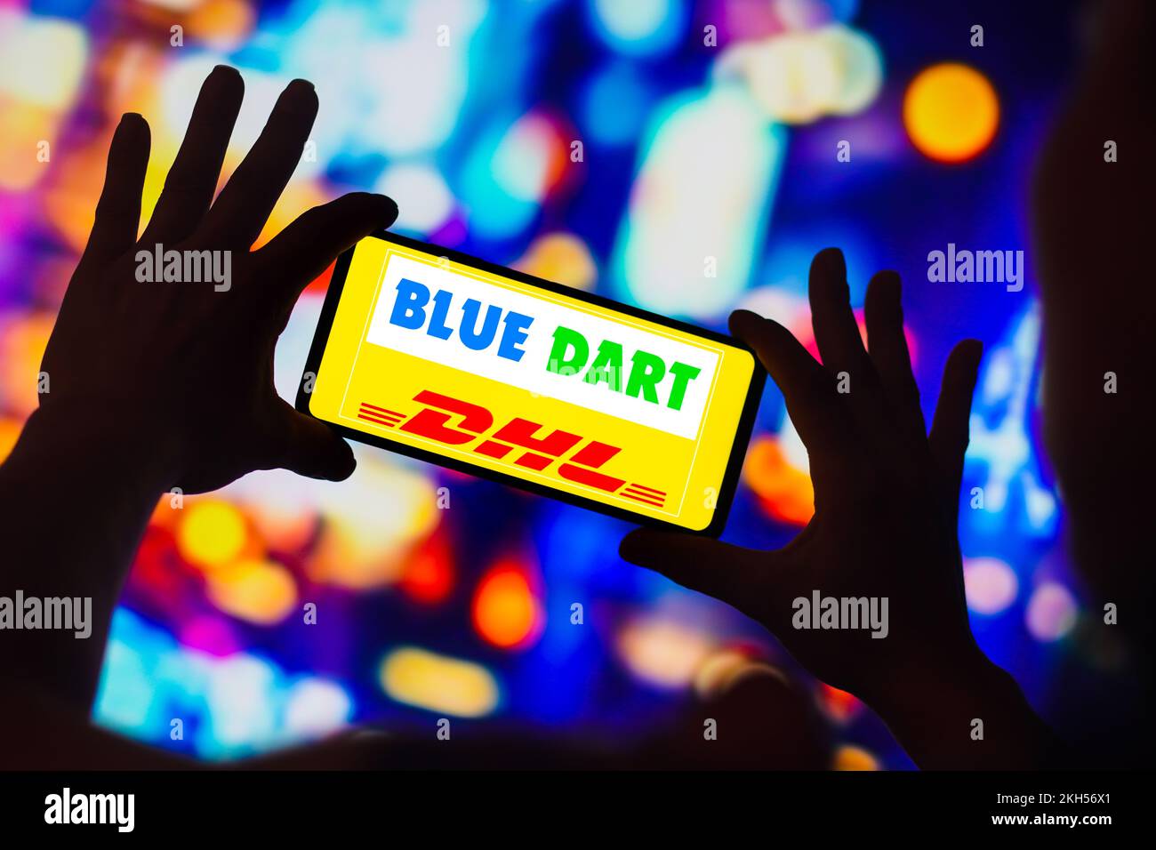 In this photo illustration, the Blue Dart DHL logo is displayed on a ...
