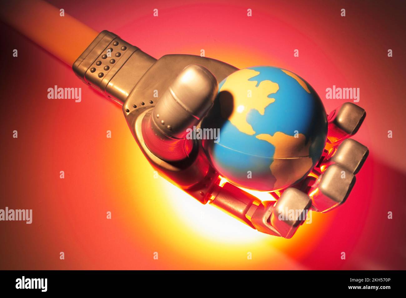 Robotic Hand with Globe Stock Photo - Alamy