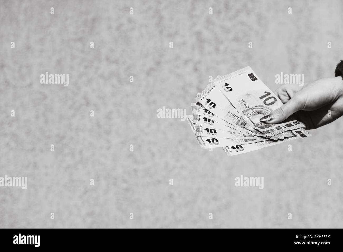 Hand holding showing euro money and giving or receiving money like tips ...