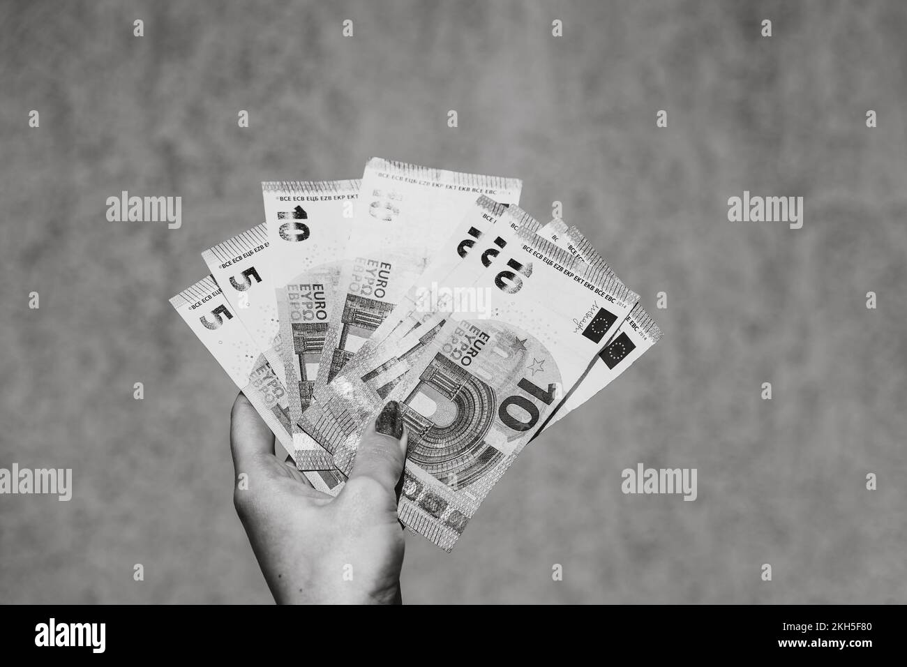 Hand holding showing euro money and giving or receiving money like tips ...
