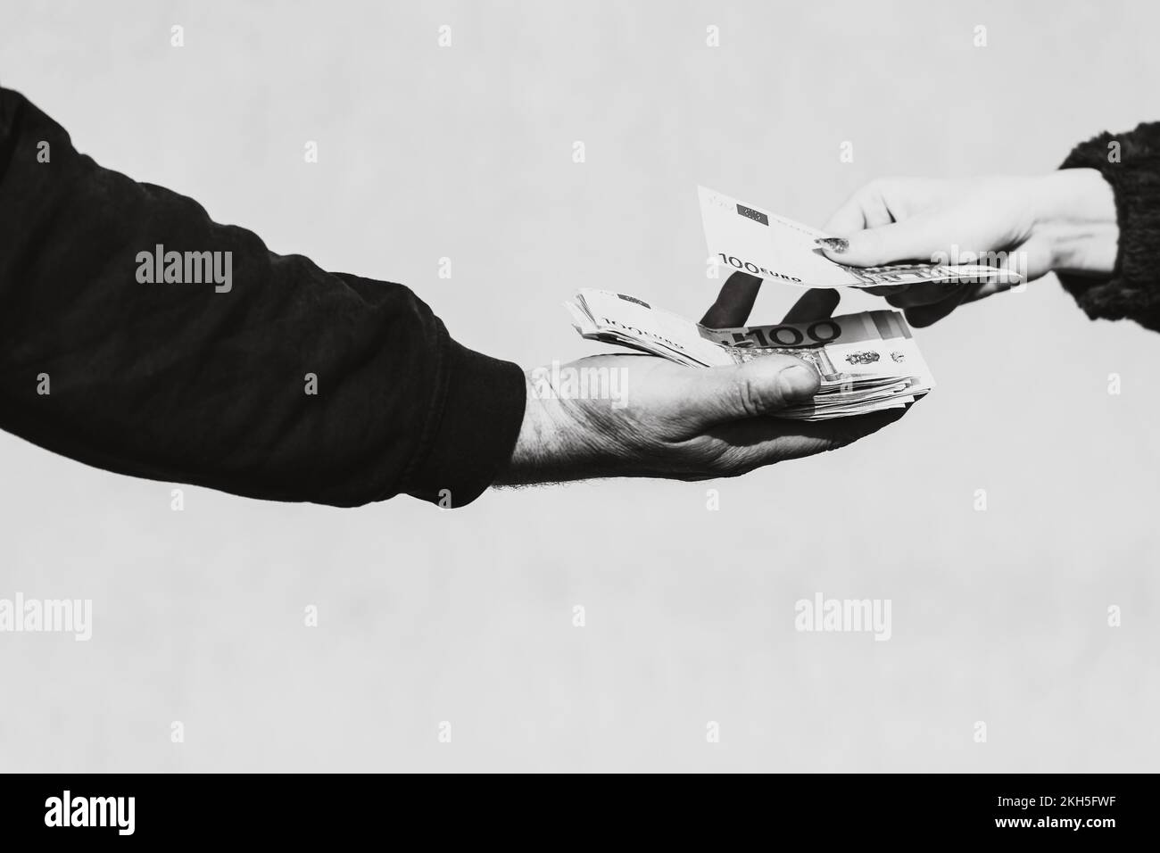 Hand giving money like bribe or tips or salary isolated, hard worked ...