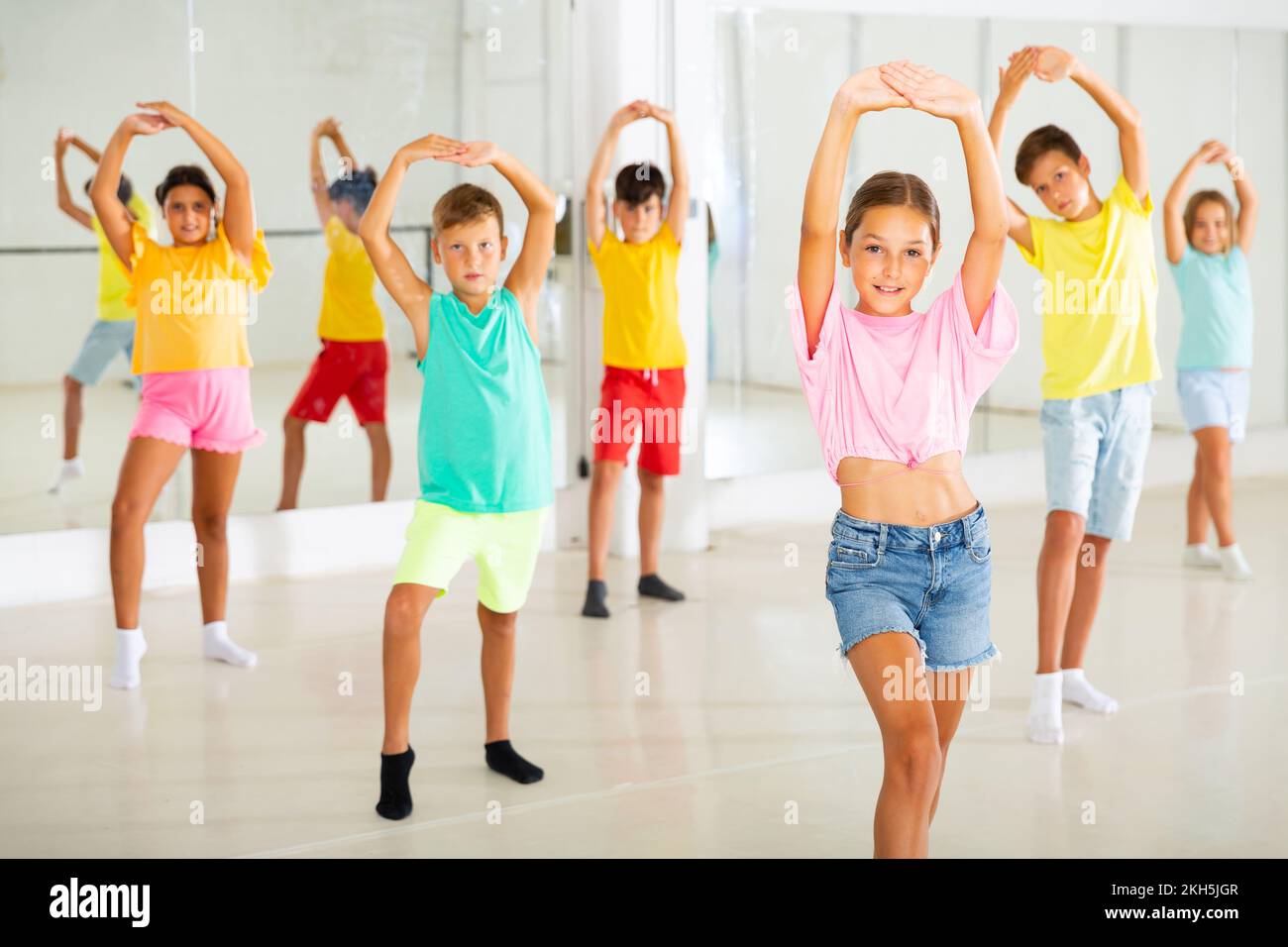 Children exercising dance moves together Stock Photo - Alamy