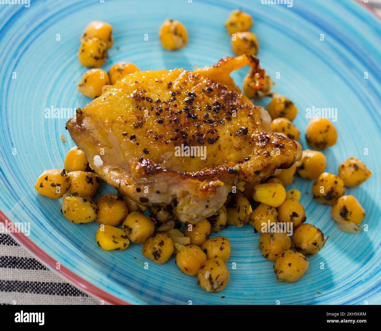 Chicken thighs with chickpeas Stock Photo - Alamy