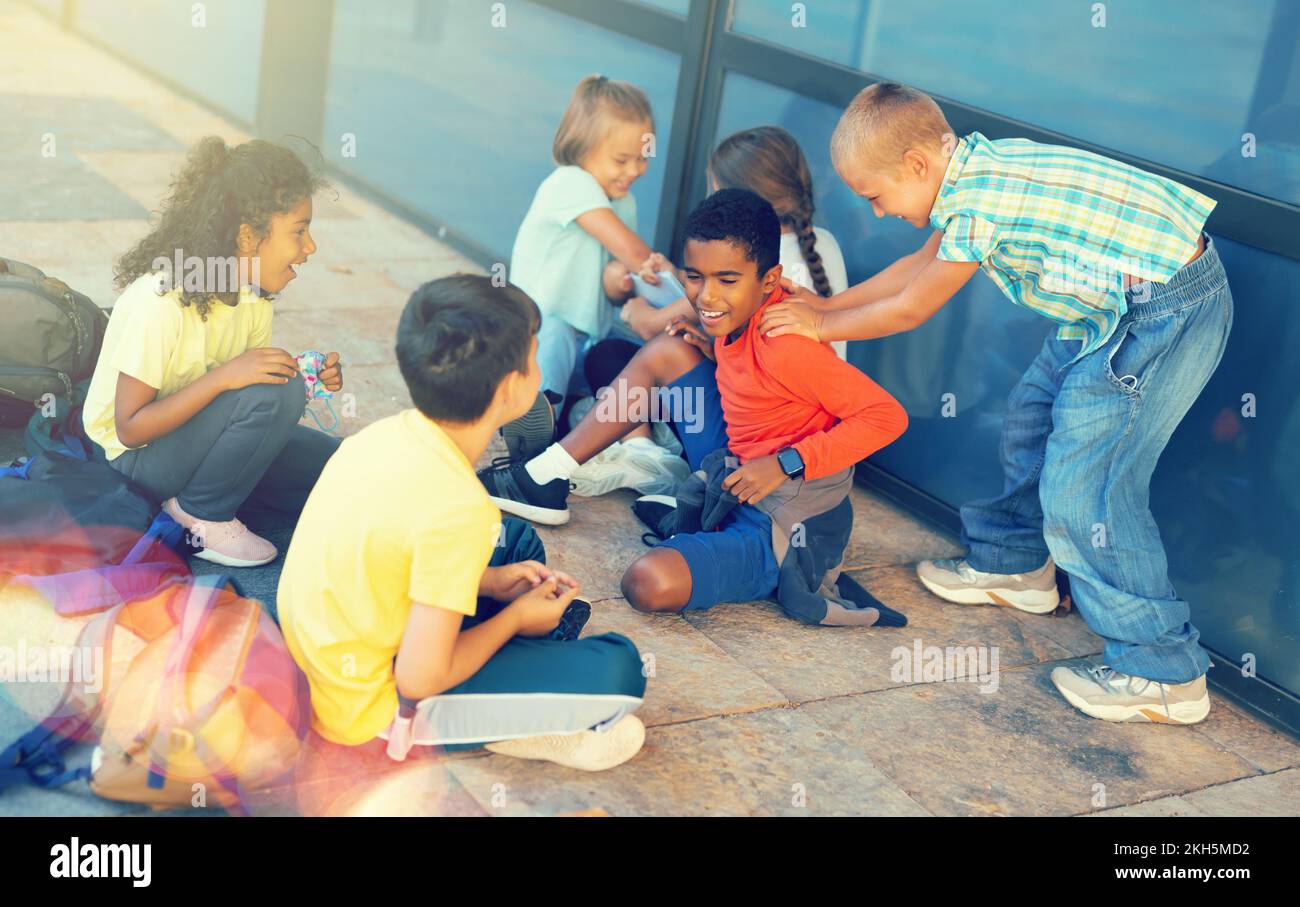 Group of children playing near school Stock Photo - Alamy