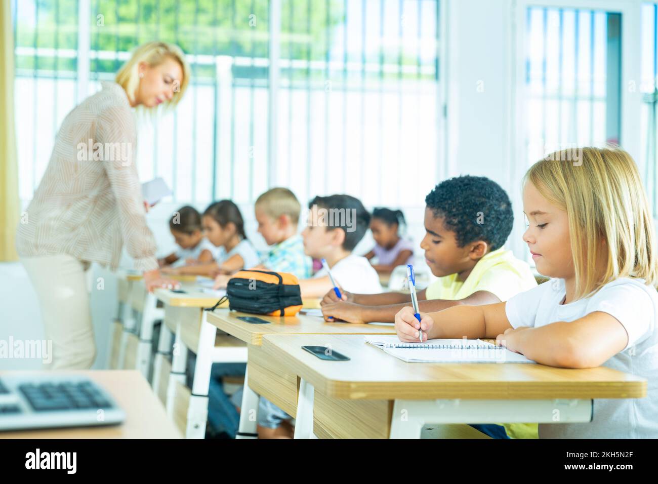 Side view of group of elementary school students Stock Photo - Alamy