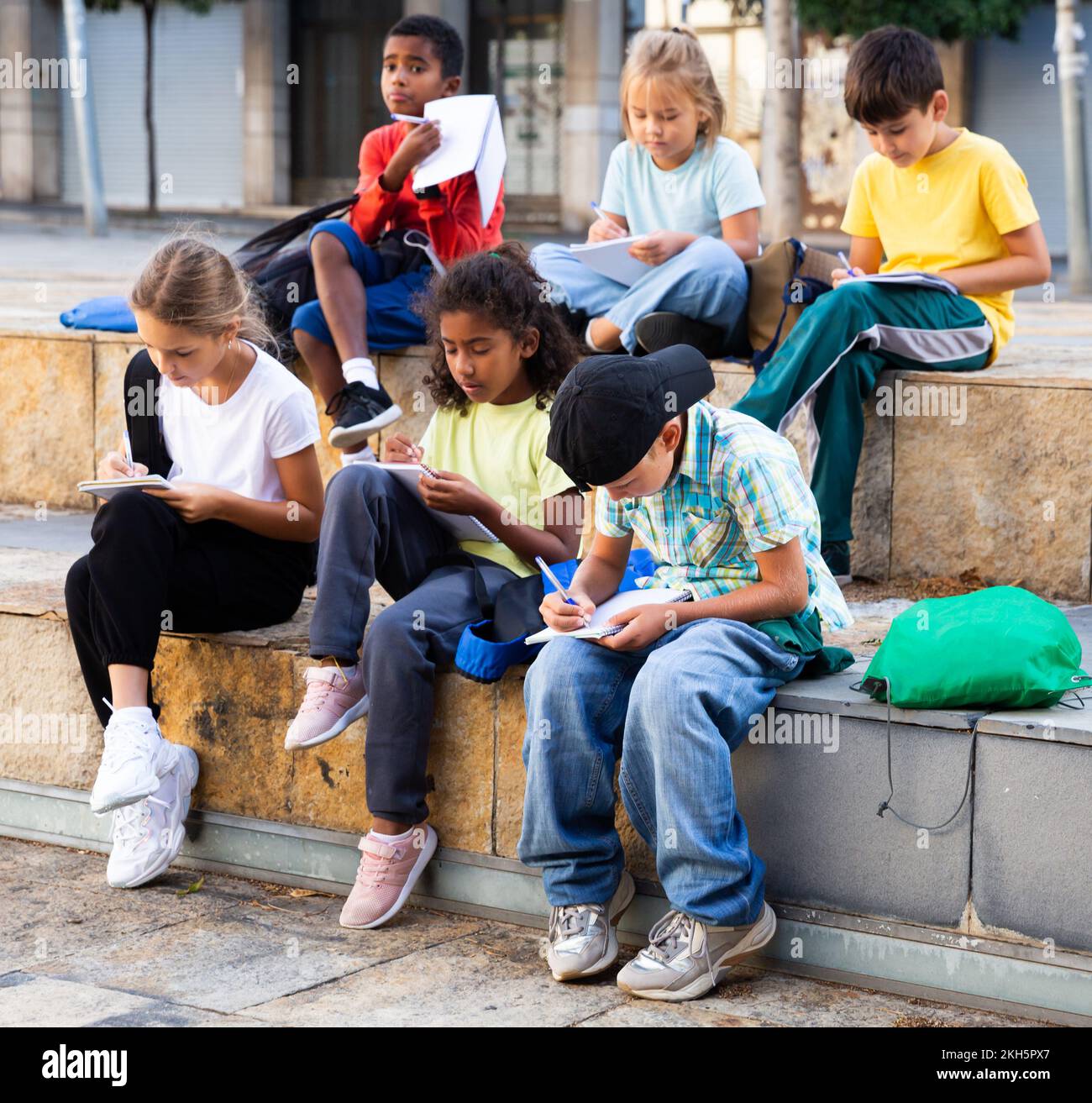Group of kids having open air lesson Stock Photo - Alamy