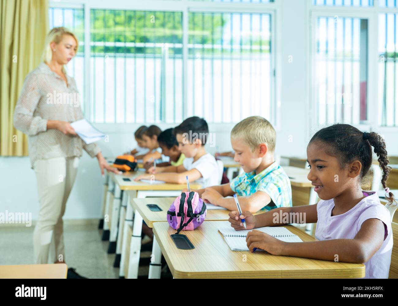 Group of focused kids working at class Stock Photo - Alamy