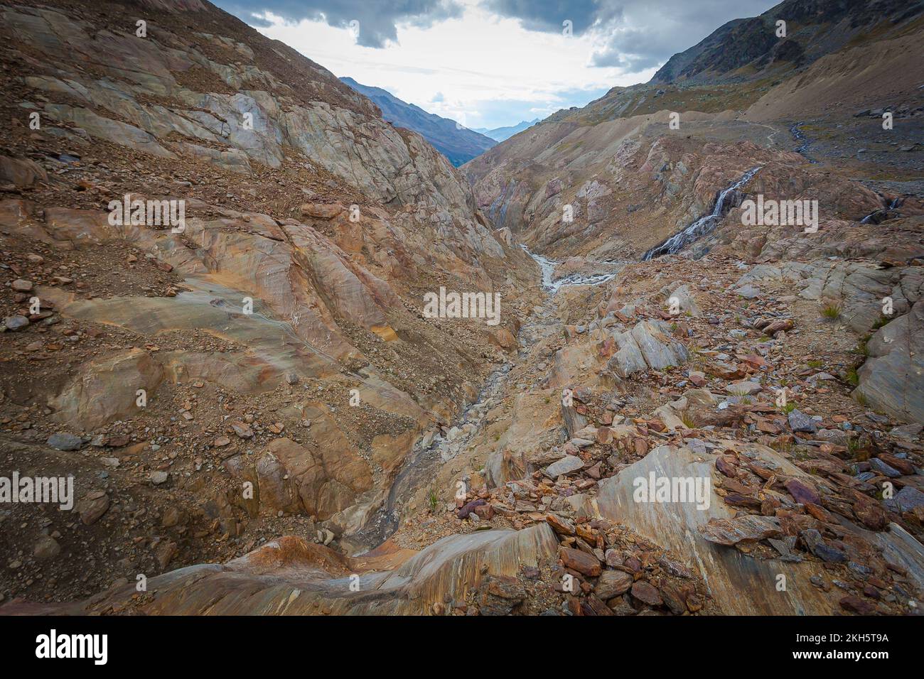 Orange and red rocks smoothed by the recently retreated Vallelunga ...