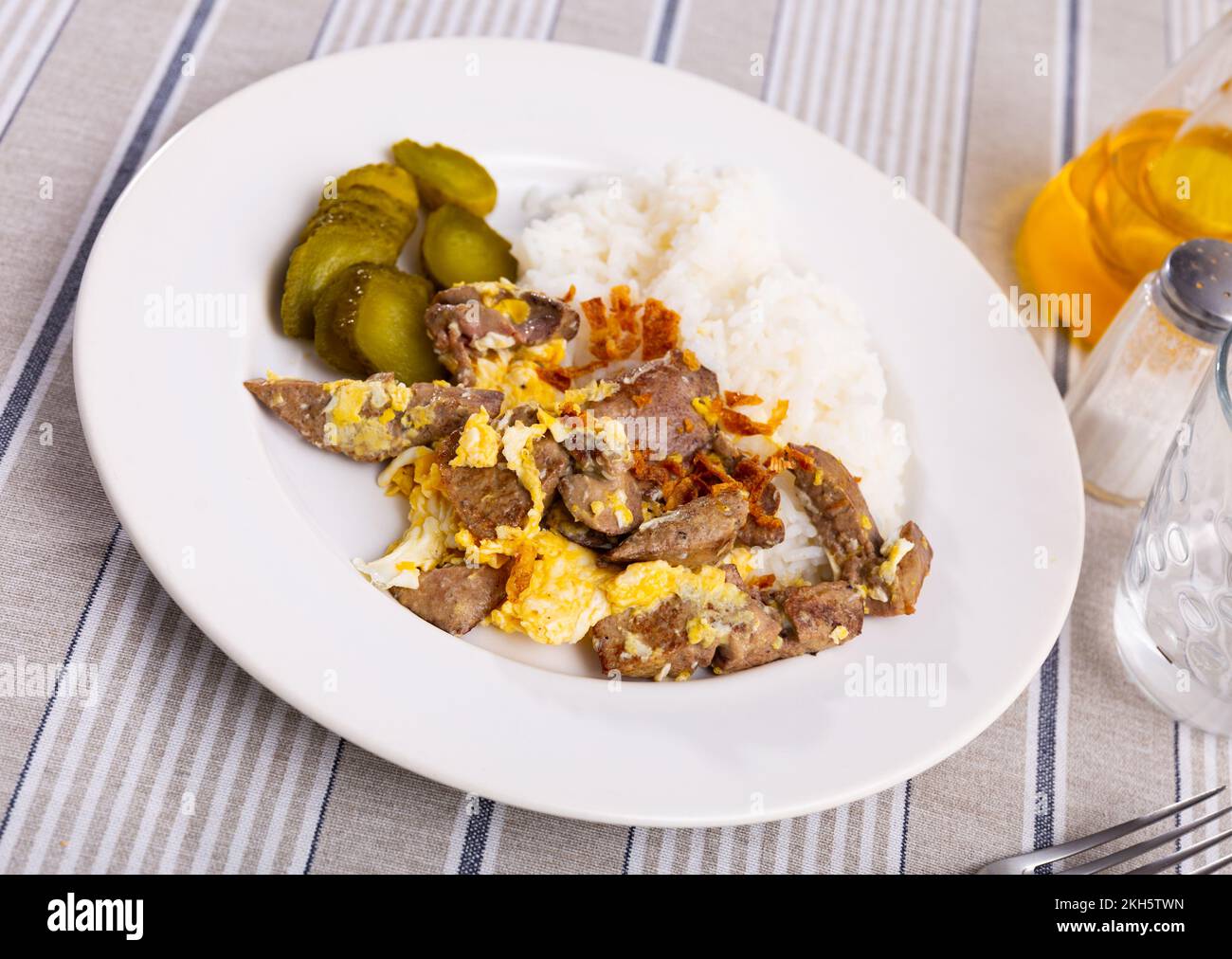 Fried omelette with rabbit liver, boiled rice and pickled cucumber ...