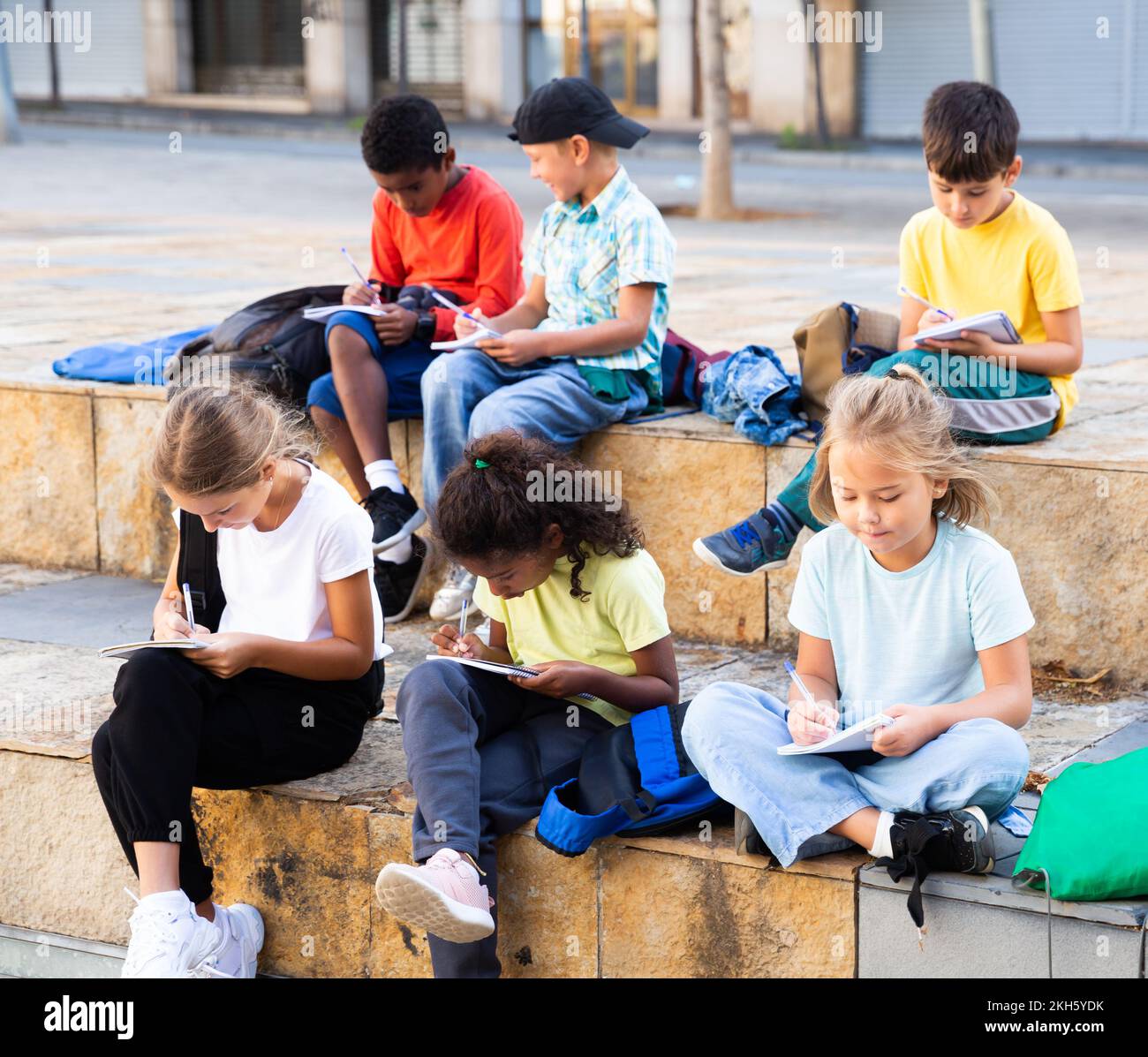 Group of kids having open air lesson Stock Photo - Alamy