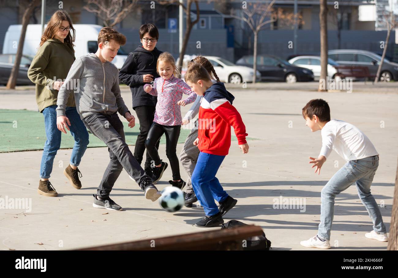 Children playing soccer with ball Stock Photo - Alamy