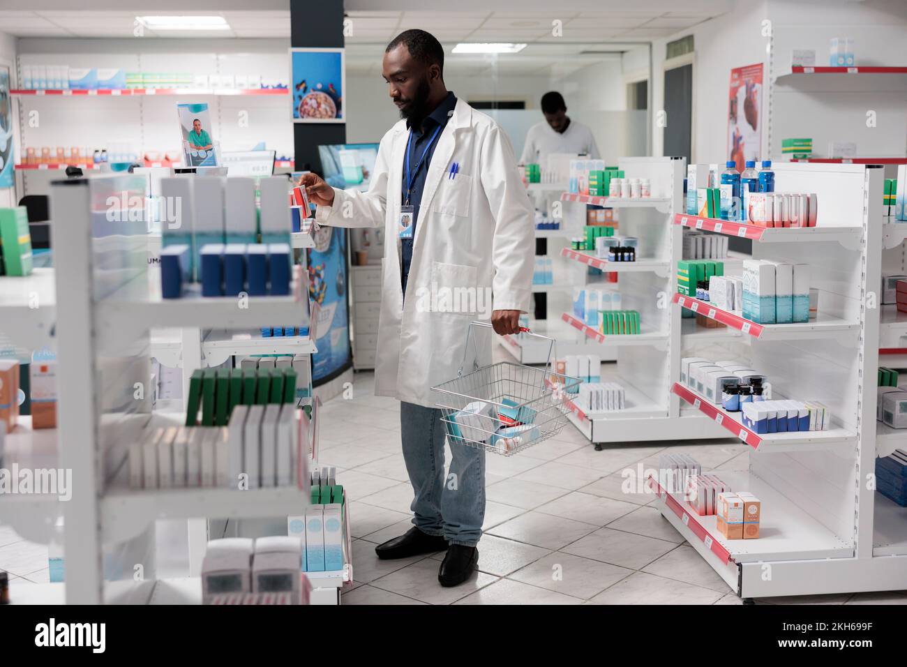 African american pharmacist checking nutritional supplements in ...