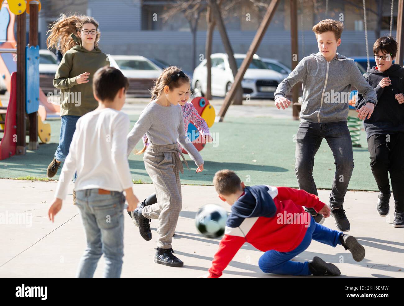 Children playing soccer with ball Stock Photo - Alamy