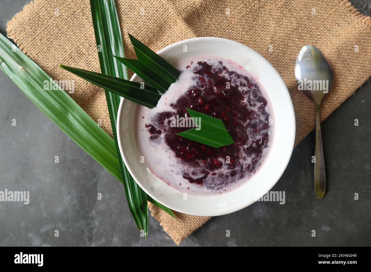 black sticky rice porridge in a bowl. bubur ketan hitam Stock Photo - Alamy