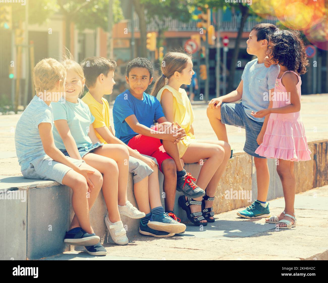 Portrait of children during conversation outdoors Stock Photo - Alamy