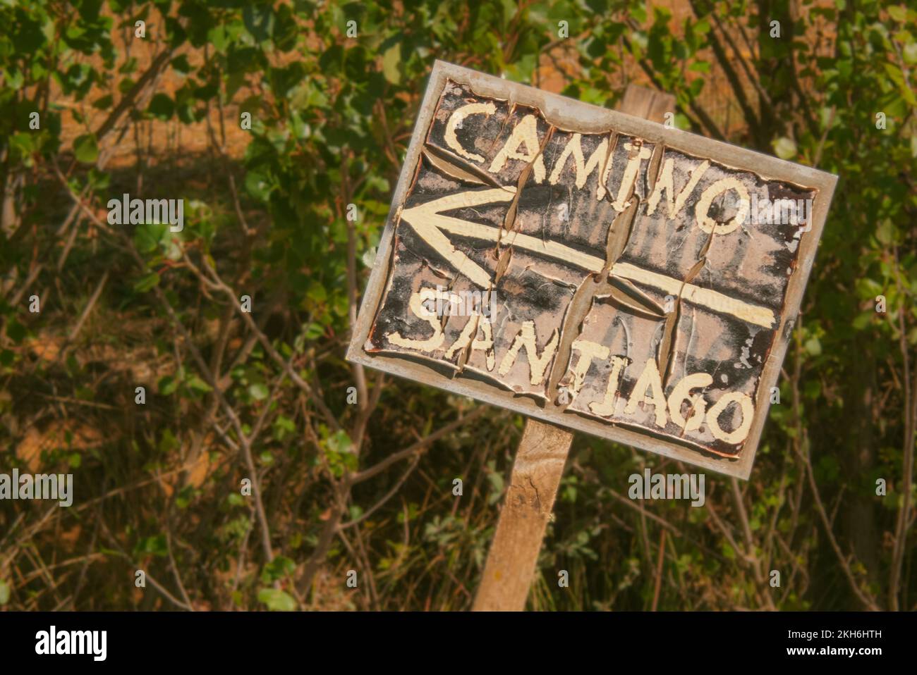 An old weathered road sign for the Camino de Santiago in the middle of ...