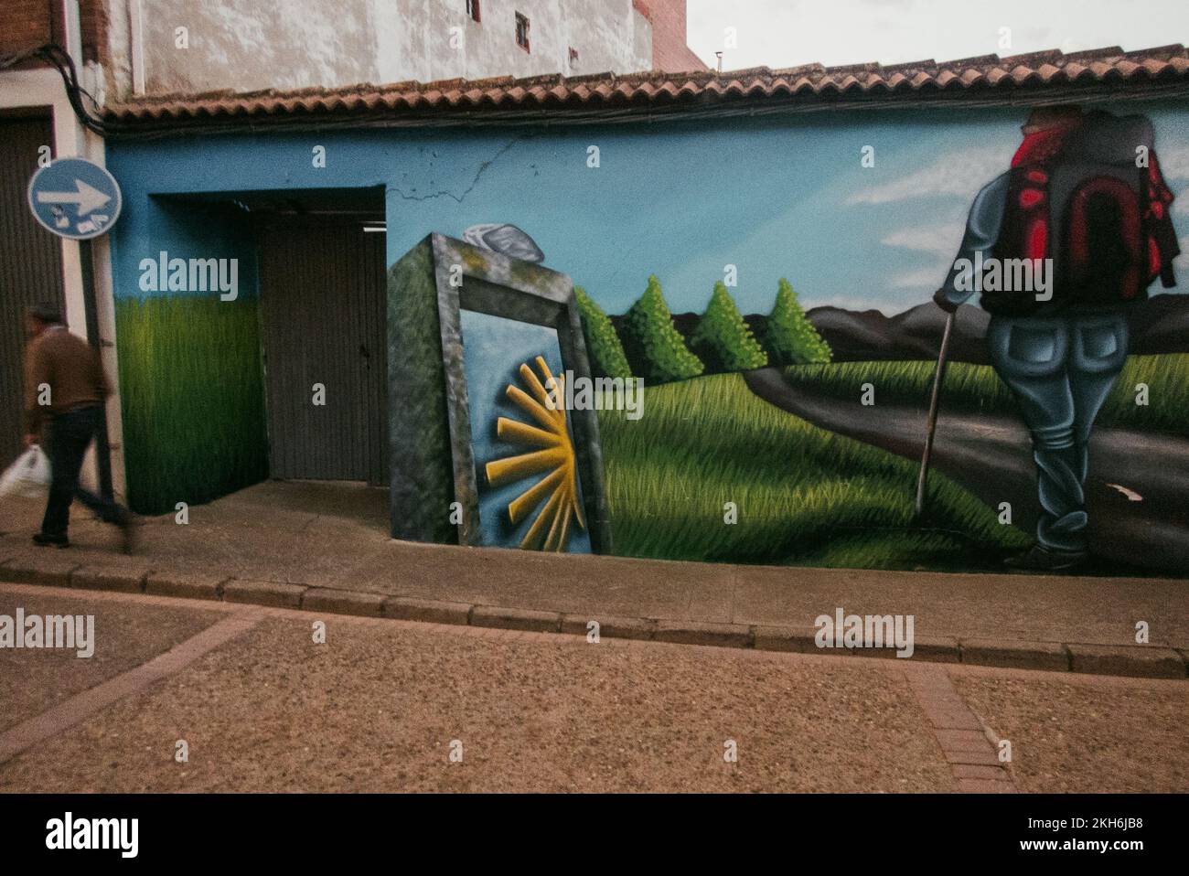 Mural of a pilgrim and a typical marker with the pilgrim's scallop ...