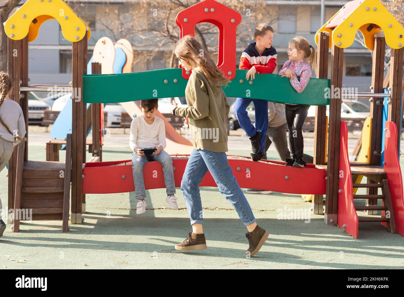 Kids playing on jungle gym Stock Photo - Alamy