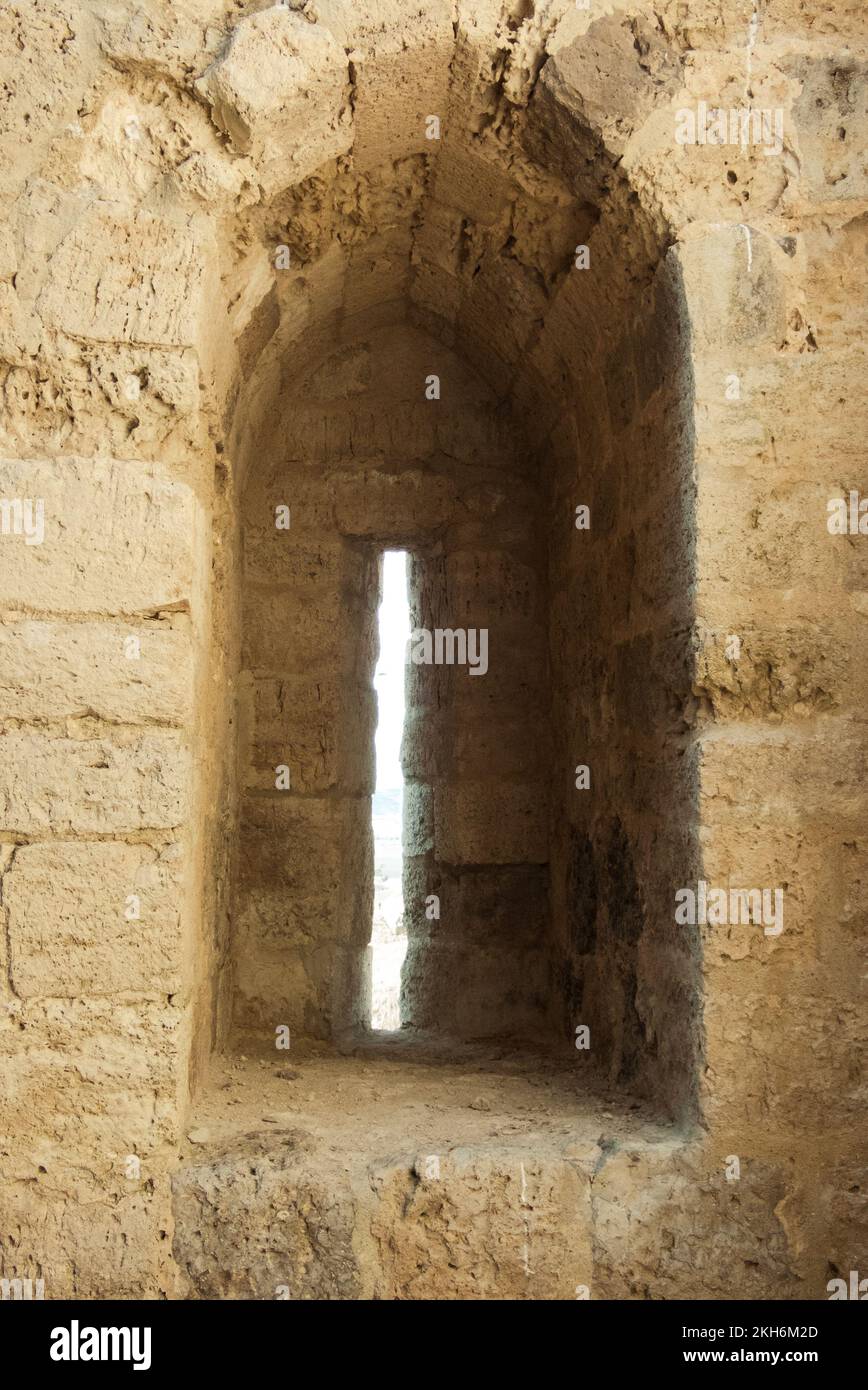 Window with a loophole in the castle of Castrojeriz Stock Photo - Alamy